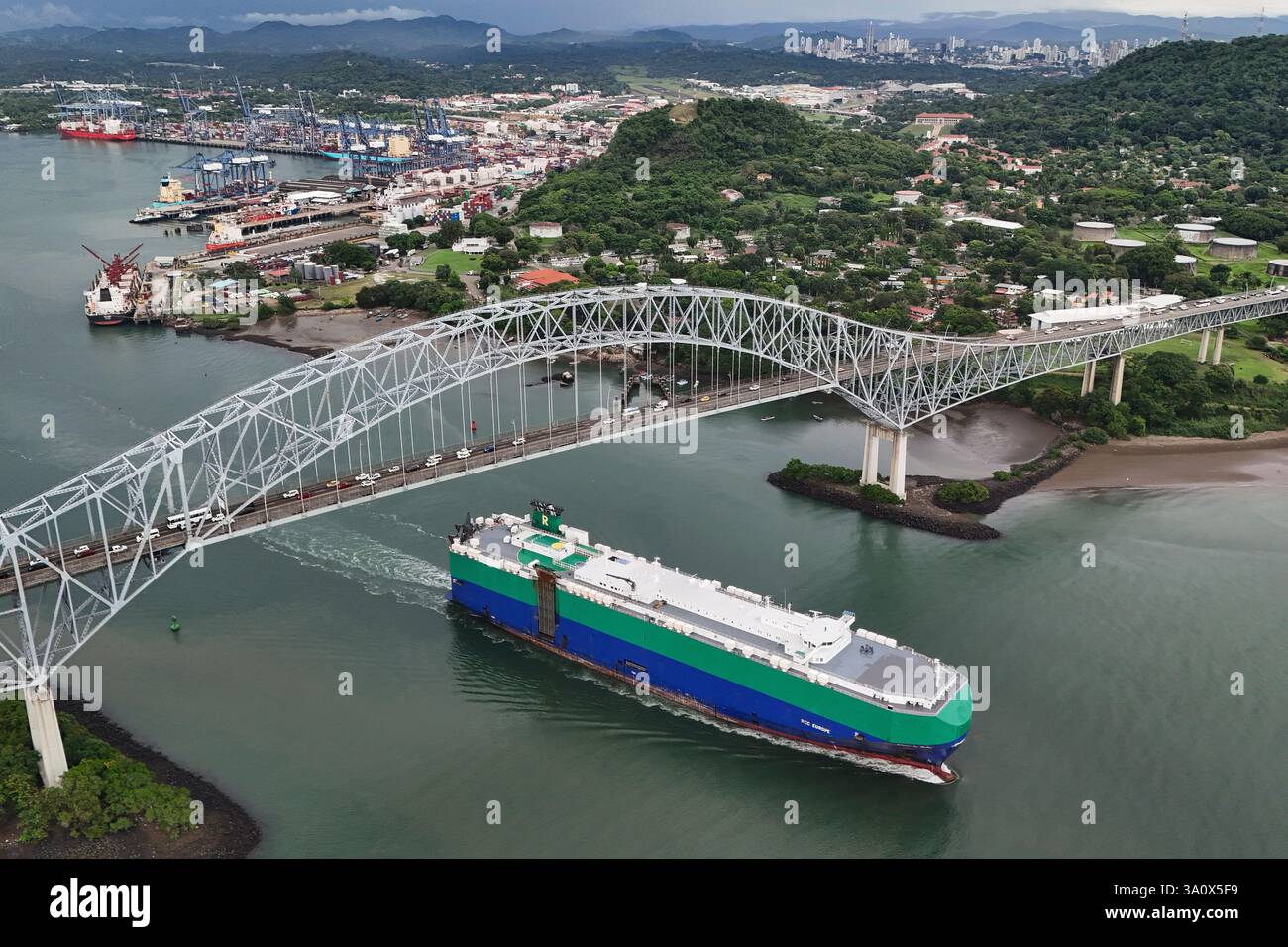 FILE - A ship sails under Las Americas bridge through the Panama Canal, in Panama City, June 13 ...