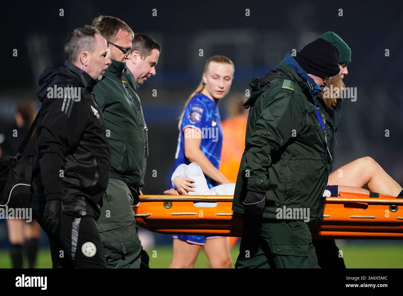 Leicester City's Ruby Mace is stretchered off the field following a ...