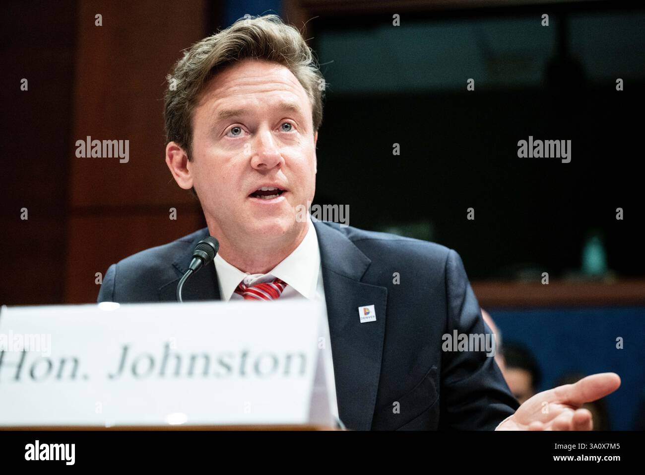 Denver Mayor Mike Johnston (D) speaking at a hearing of the House ...