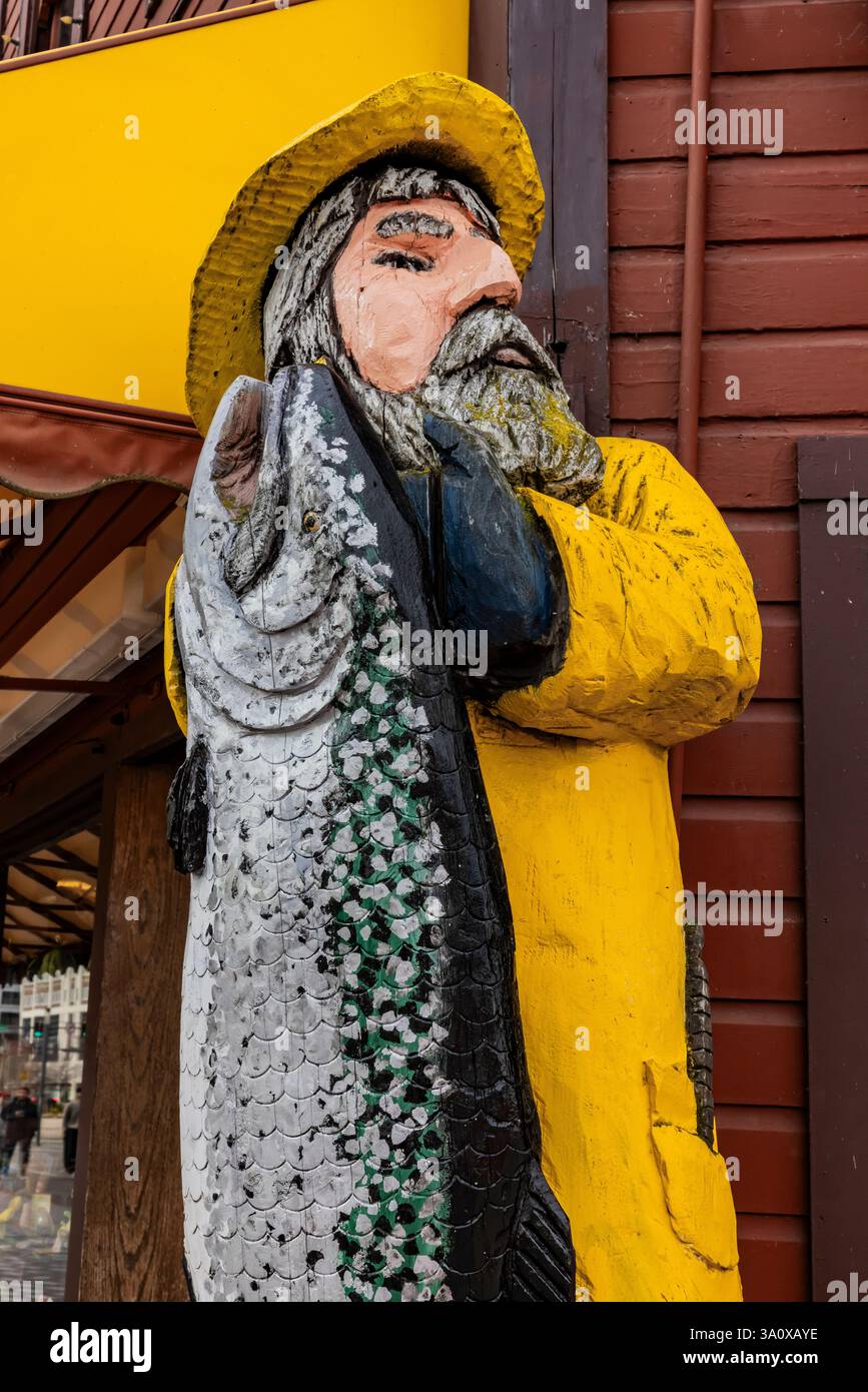 Carved fisherman and salmon at The Fisherman's Restaurant and Bar sign ...