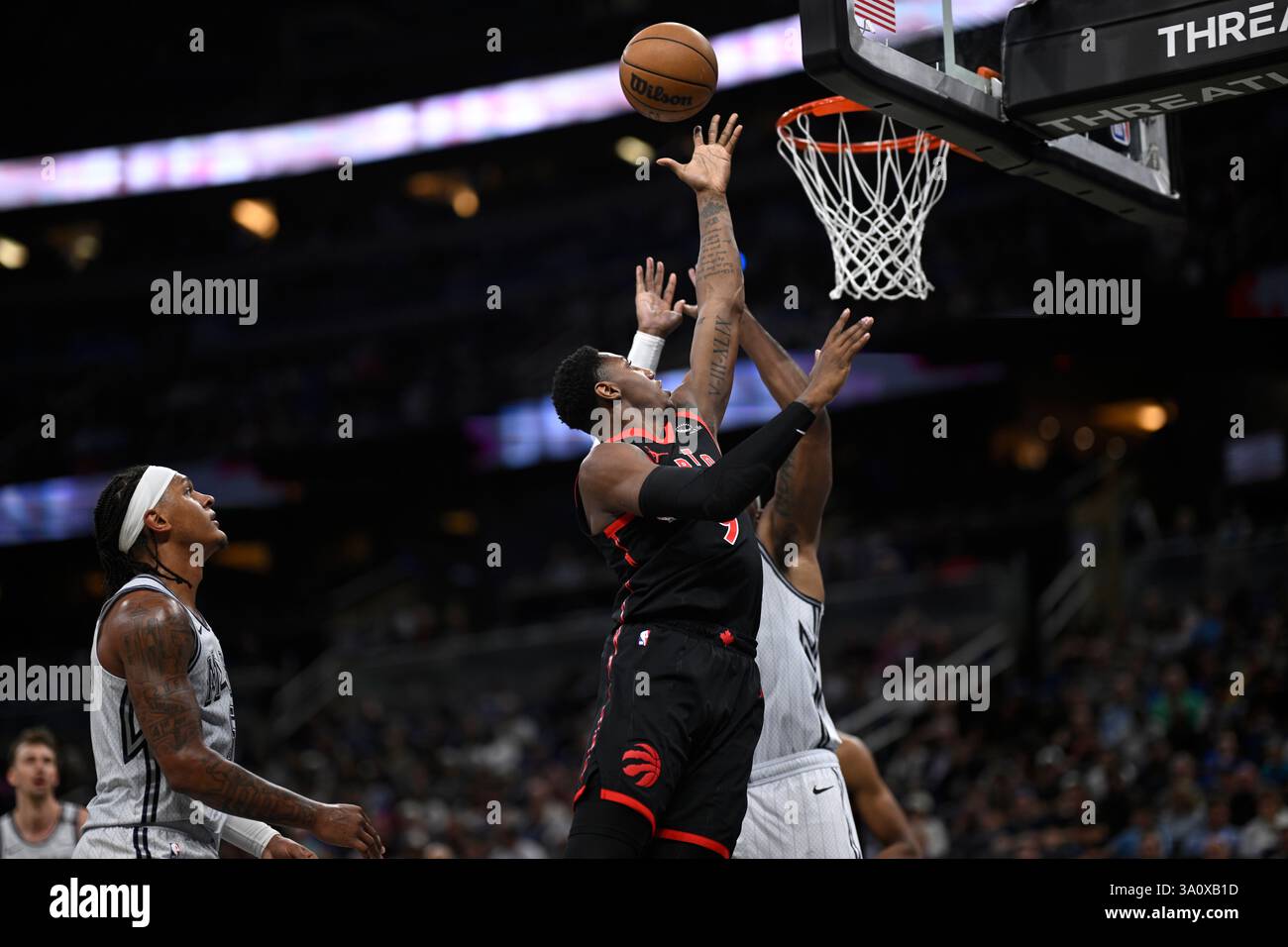Toronto Raptors guard RJ Barrett (9) puts up a shot as Orlando Magic ...