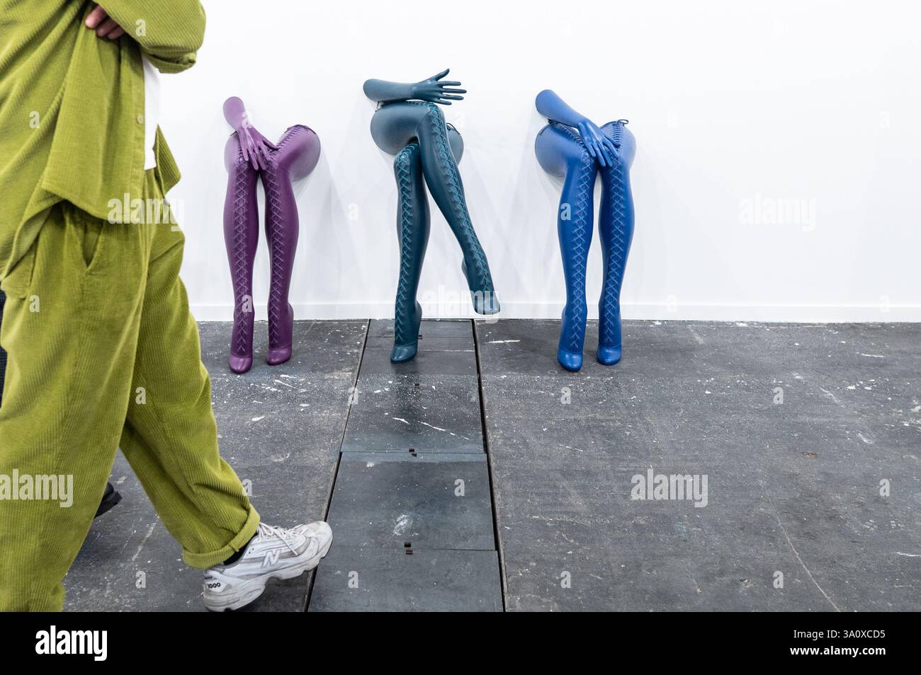 Madrid, Spain. 05th Mar, 2025. A visitor walks by an artwork of artist ...