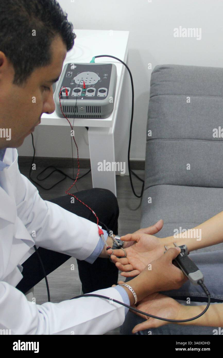 Dark-skinned Latino neurologist specialist doctor performs ...