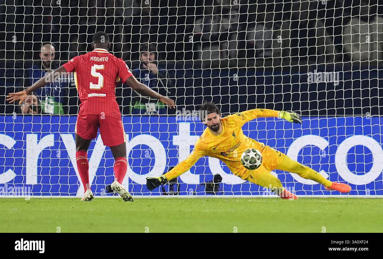 Liverpool goalkeeper Alisson Becker (right) makes a save during the ...