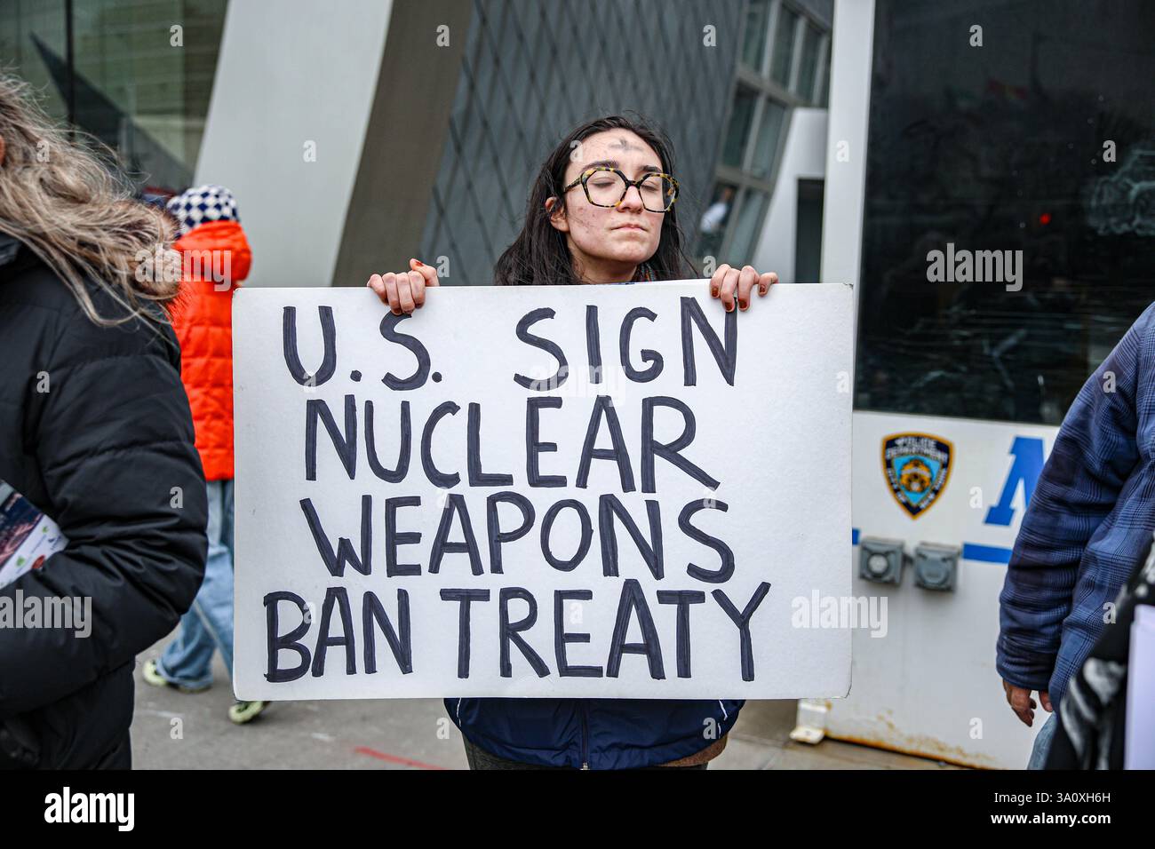 New York, New York, USA. 5th Mar, 2025. A woman protester with an ash ...