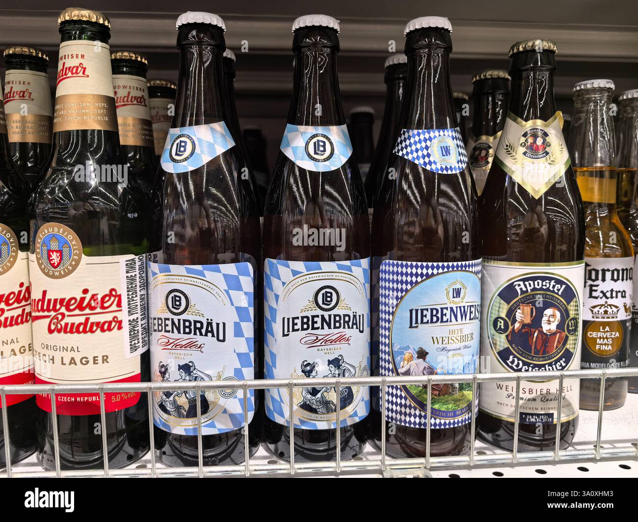 Bobruisk, Belarus - February 22, 2025: Rows of various German beers are lined up on a store ...