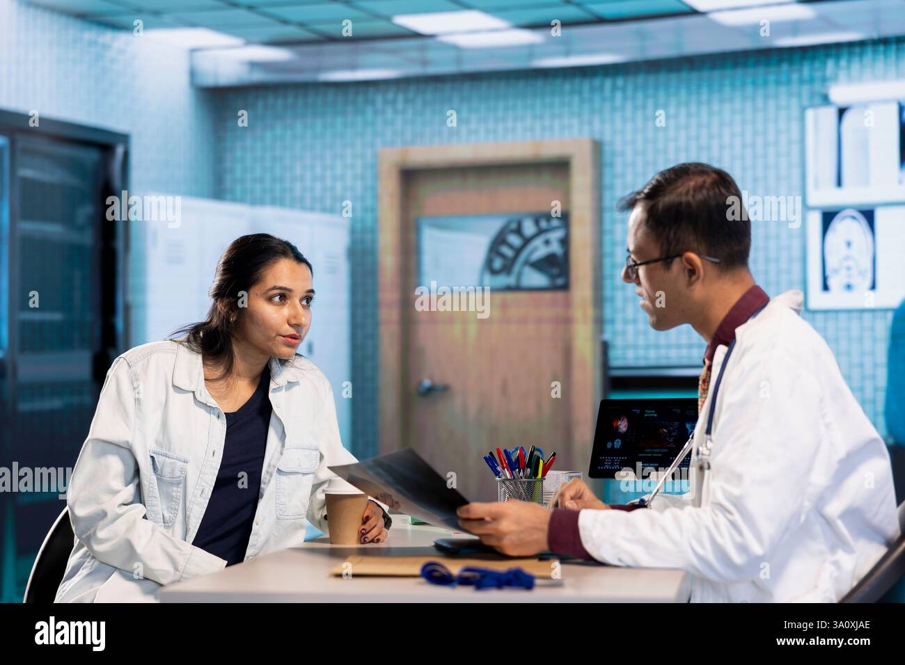 Indian healthcare expert sharing medical expertise with a patient in ...