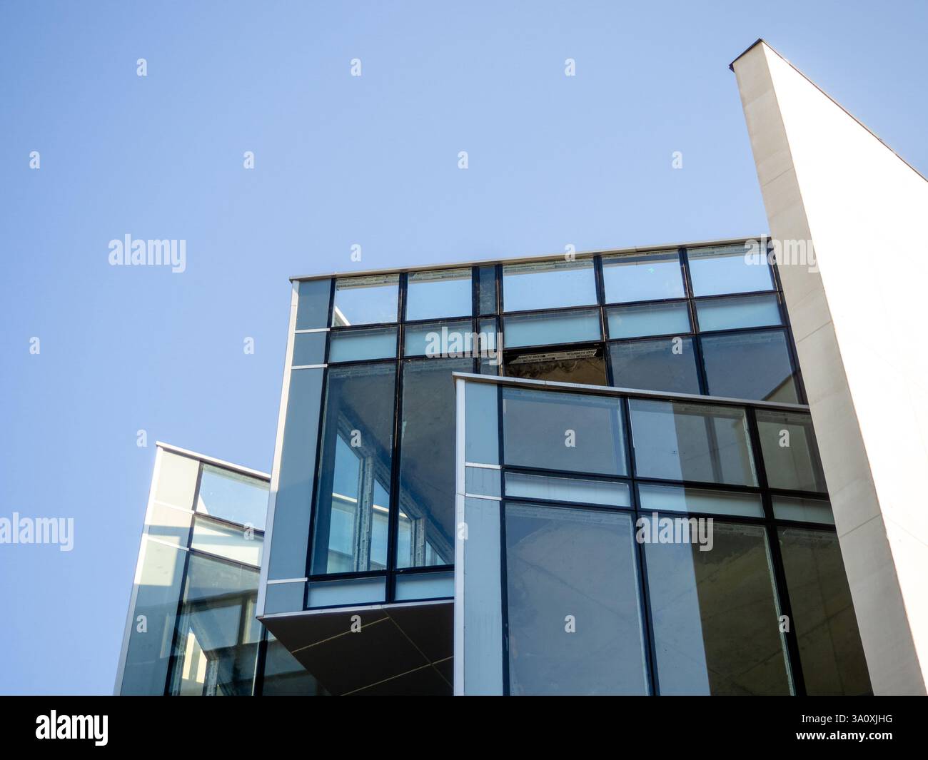 Design and construction of a modern building. Glass and concrete ...