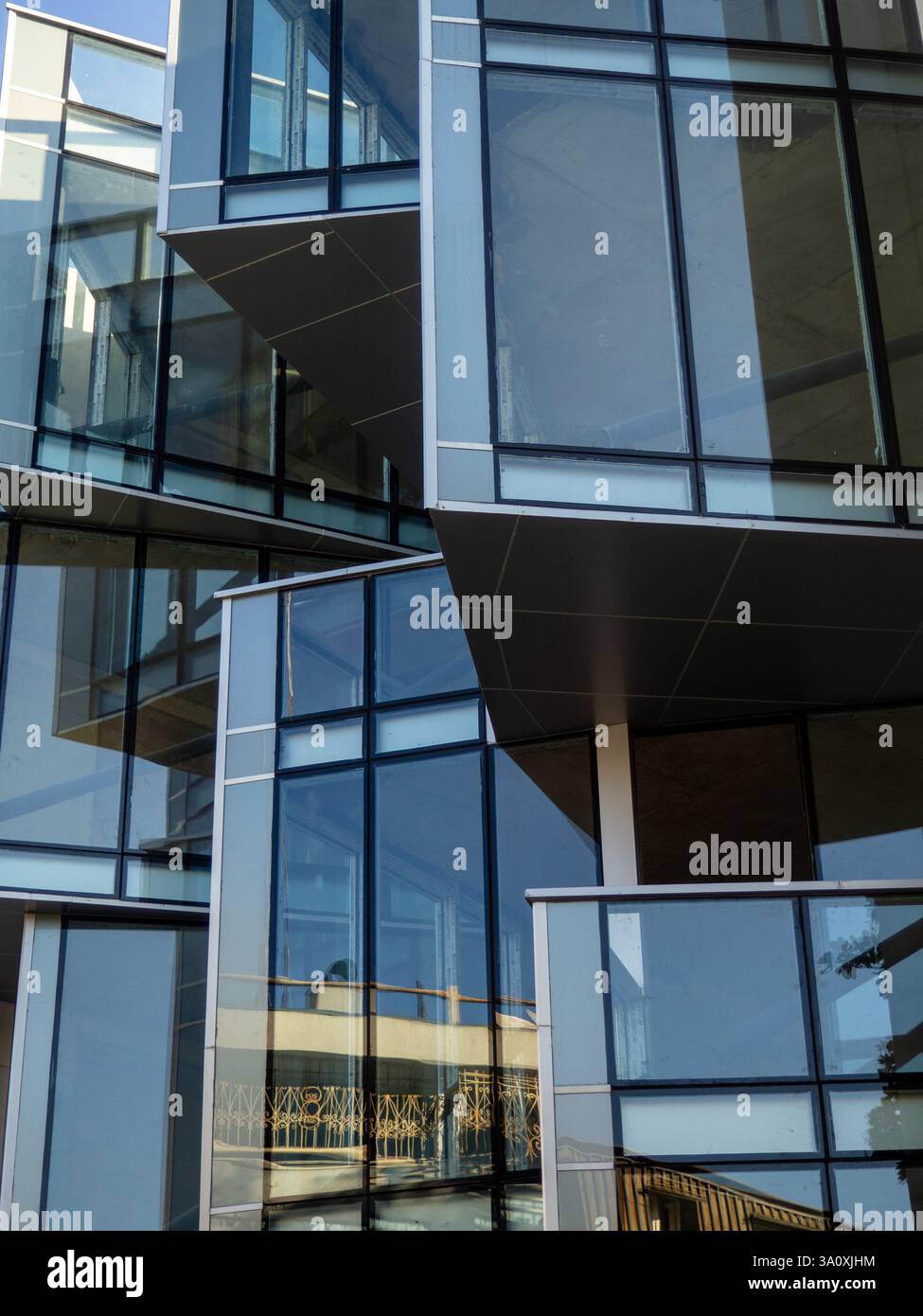 Design and construction of a modern building. Glass and concrete ...