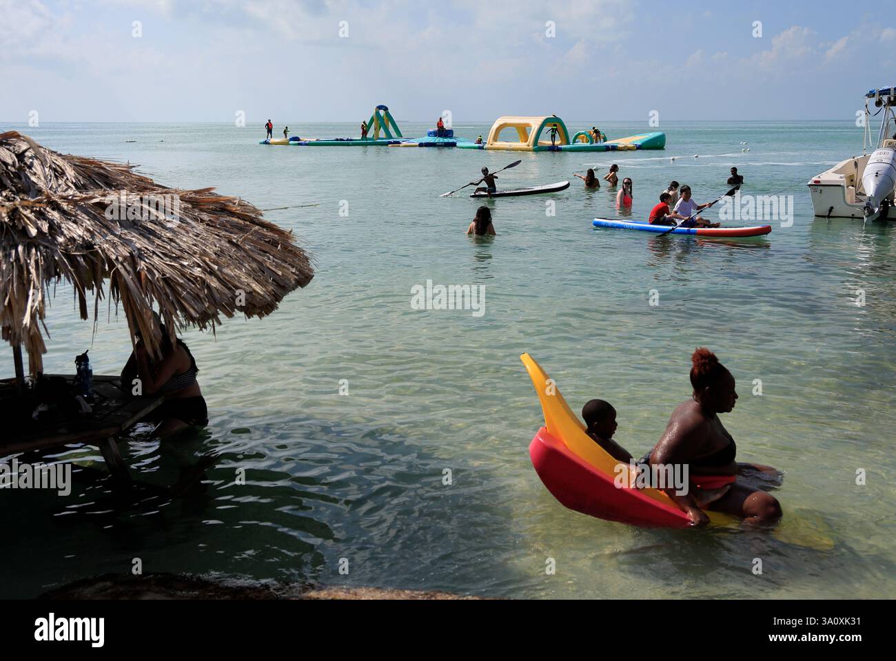 Water activities by the Secret Beach near San Pedro, Ambergris Caye ...