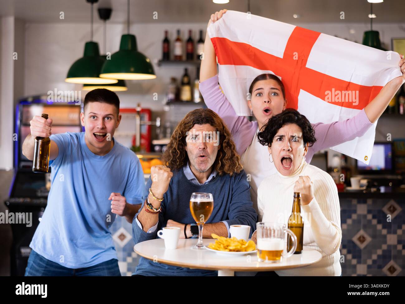 Group of friends, sports supporters cheering for favorite team with ...