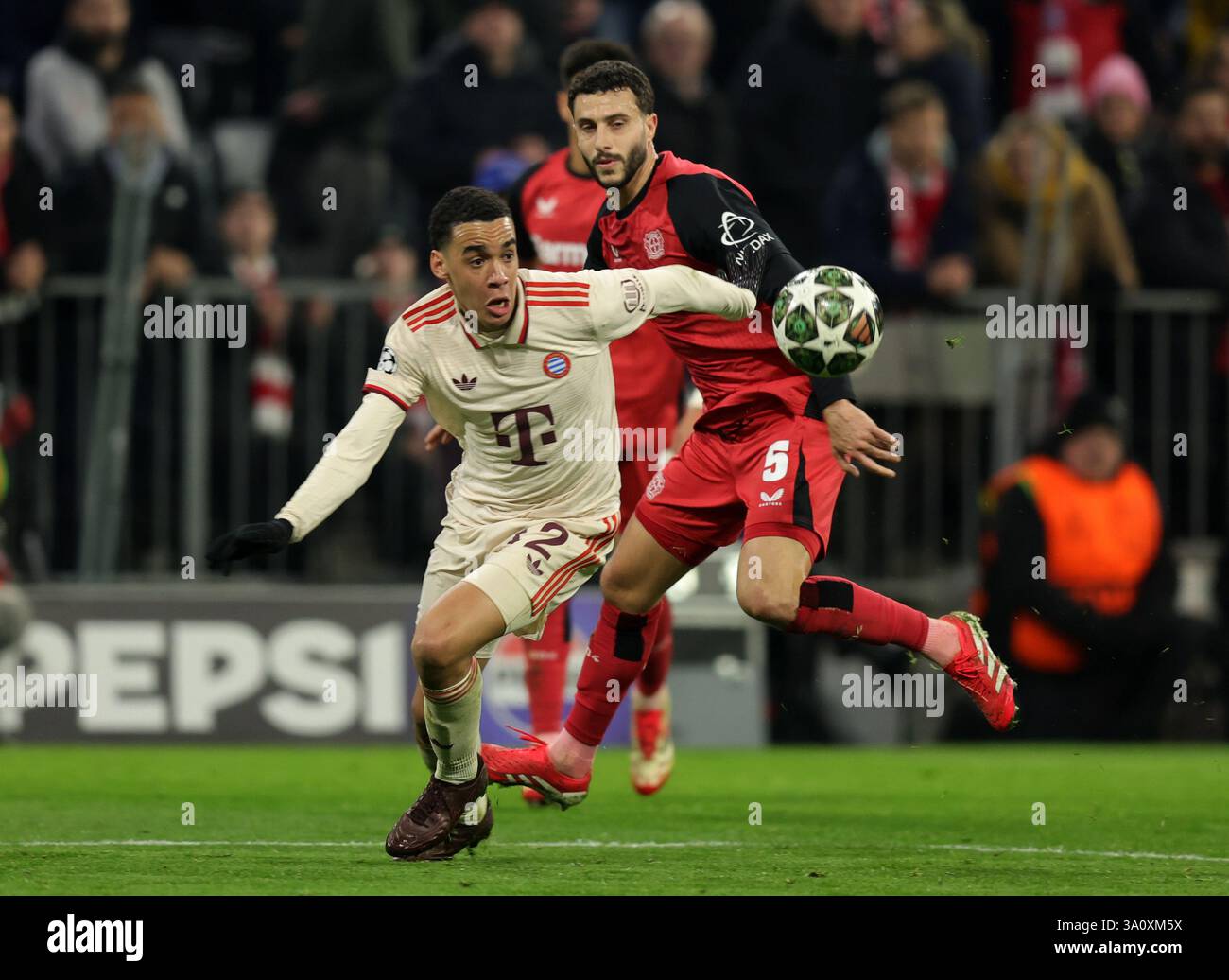 MUNICH, GERMANY - MARCH 05: Jamal Musiala of FC Bayern Muenchen , Mario ...