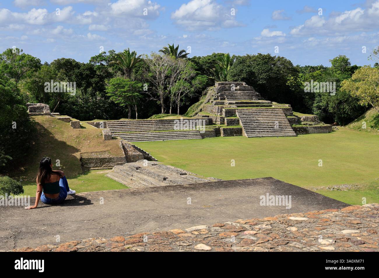 A visitor on the top of Temple of the Masonry Altars with the ruins of ...