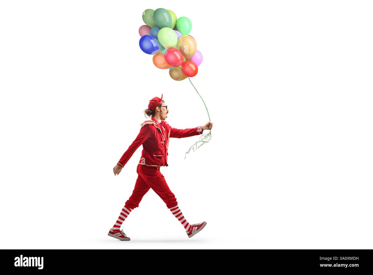 Funny entertainer walking and carrying a bunch of balloons isolated on ...