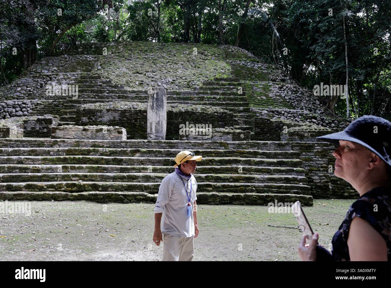 Visitor and guide at Stela Temple aka Stela 9 Temple in archaeological ...
