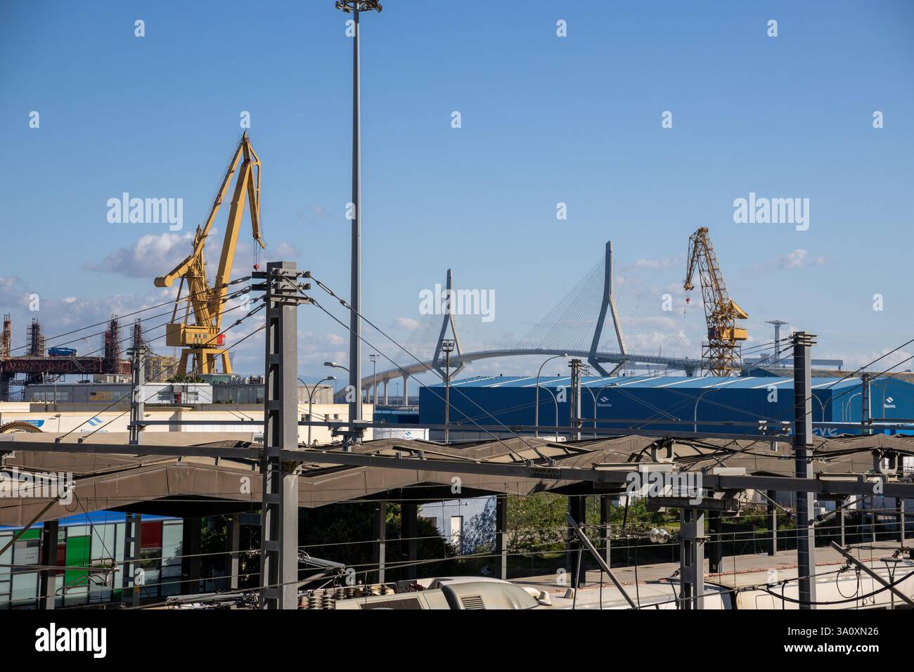 ADIF-RENFE train station in Cádiz, Spain, and maritime port cranes ...