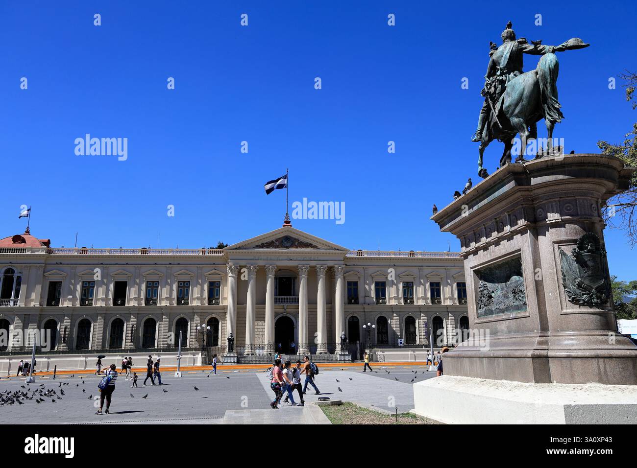 National Palace of El Salvador with the monumental statue of president ...