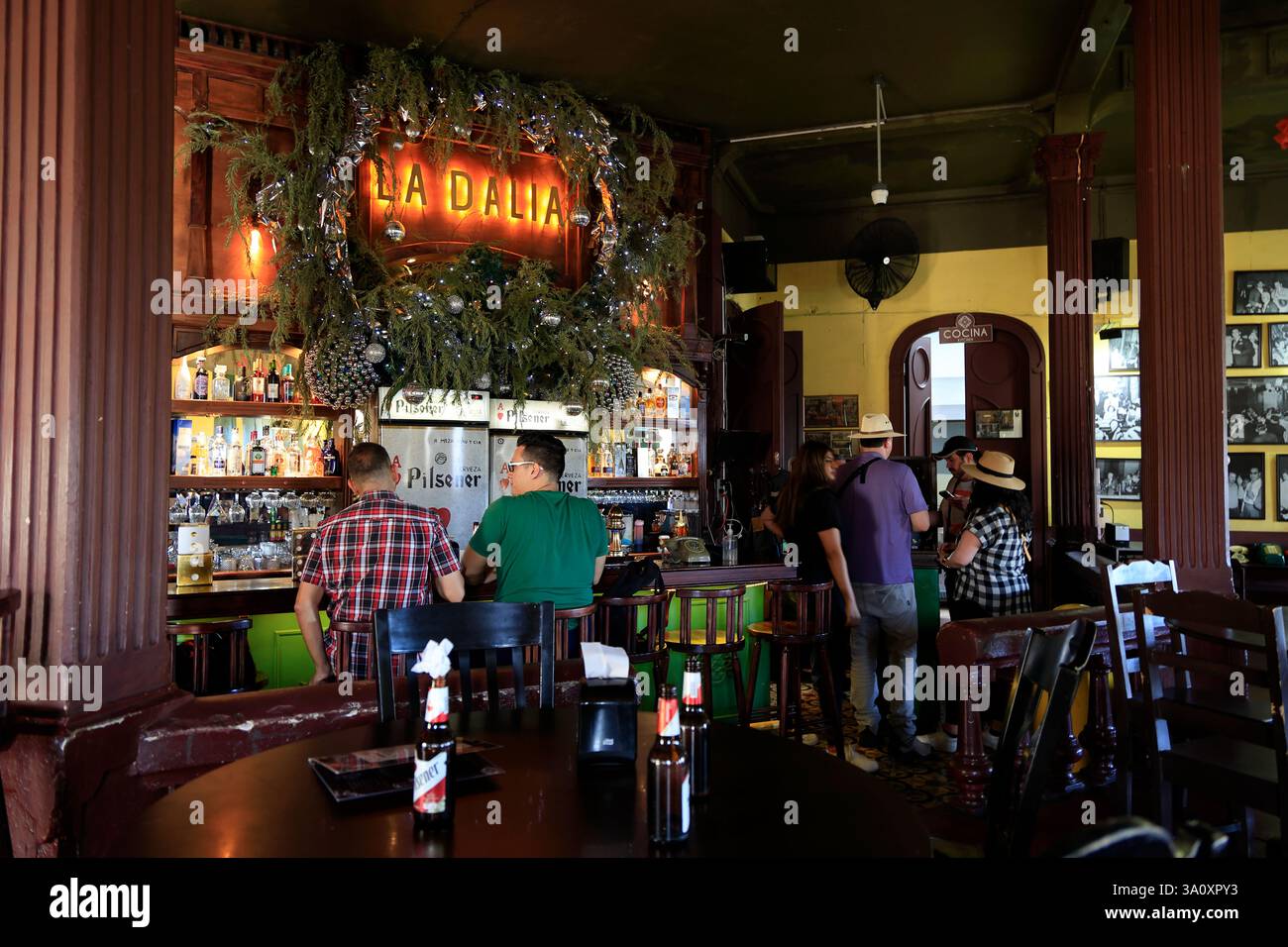 The bar with the sign of La Dalia inside of Club La Dalia, a historic ...