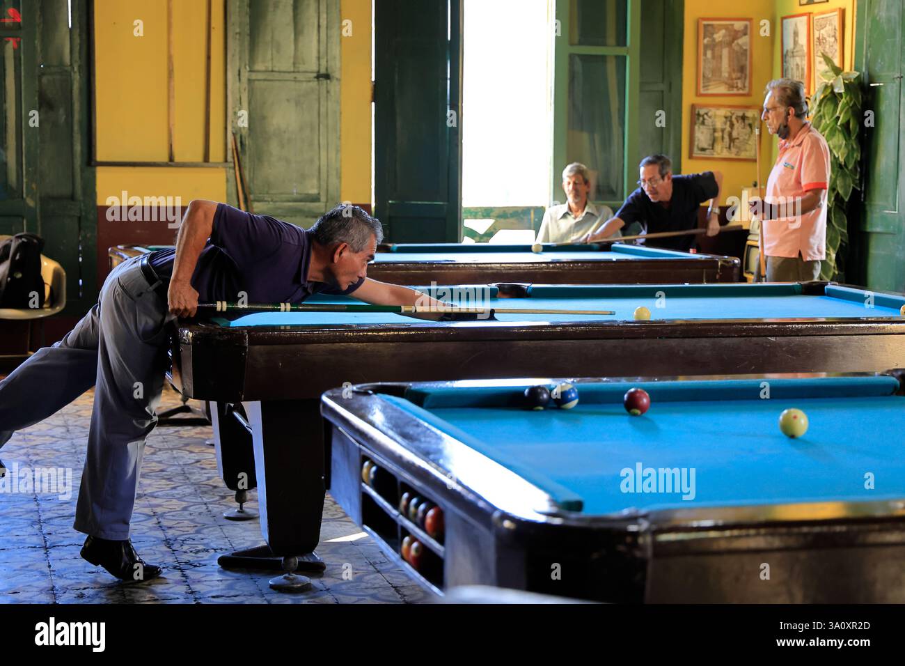 People playing billiards in Club La Dalia, a historic billiards club ...