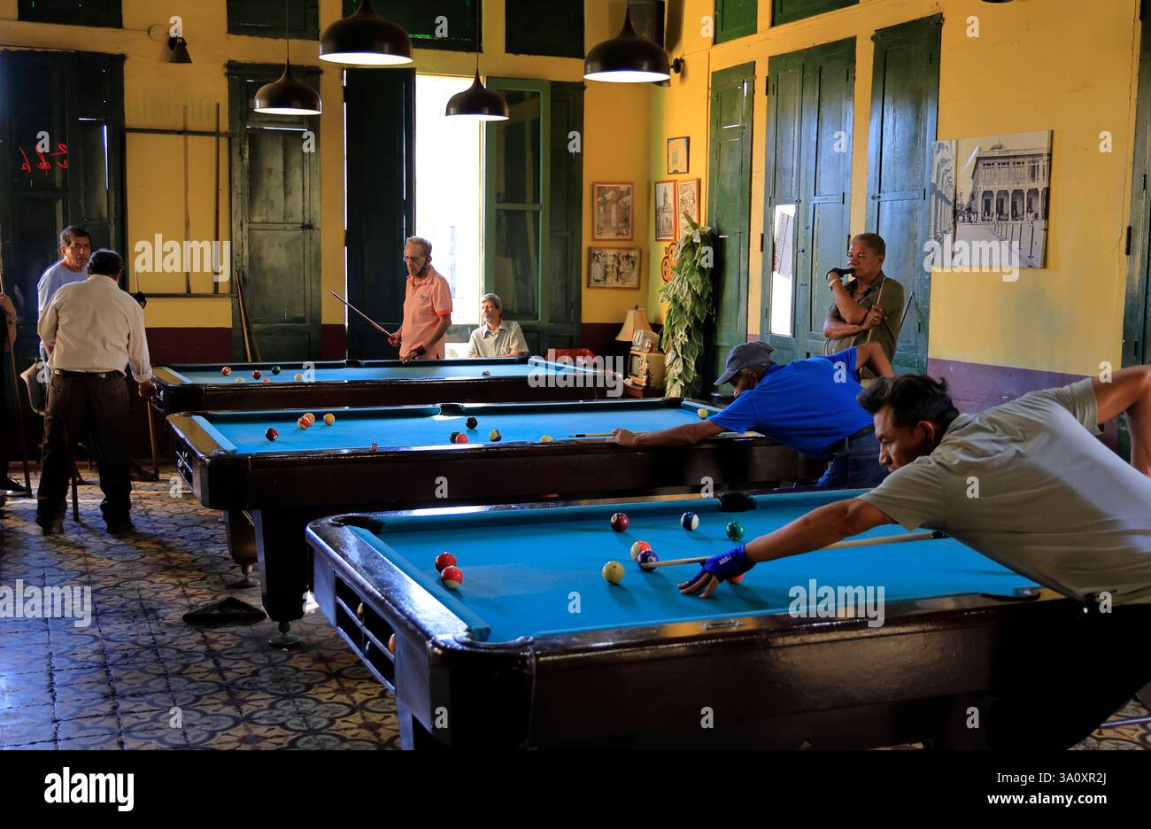 People playing billiards in Club La Dalia, a historic billiards club ...