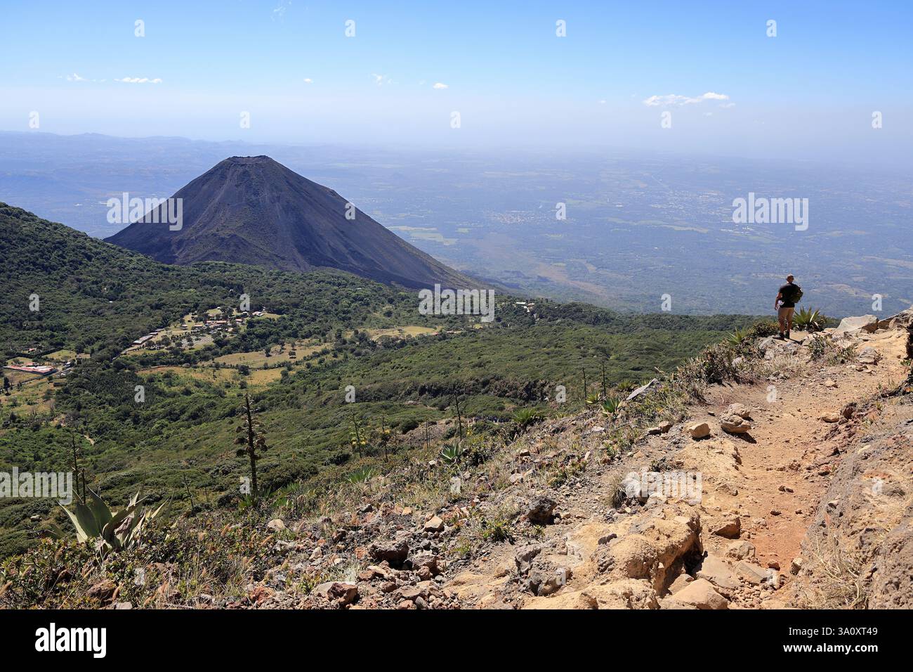 The view of active Izalco Volcano with a hiker on the trail on the ...