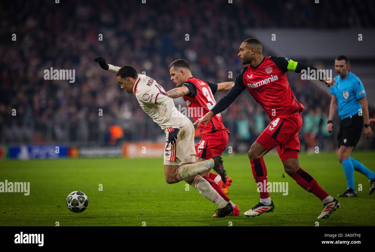 Munich, Germany. 05th Mar 2025. Jamal Musiala (FCB) Granit Xhaka (LEV) Jonathan Tah (LEV) FC ...