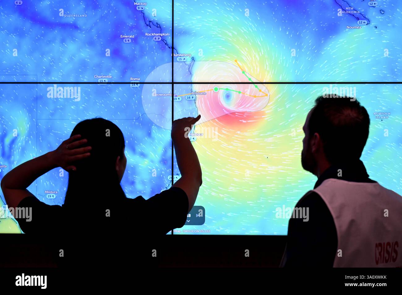 Canberra, Australia. 06th Mar, 2025. Staff look at a map showing ...