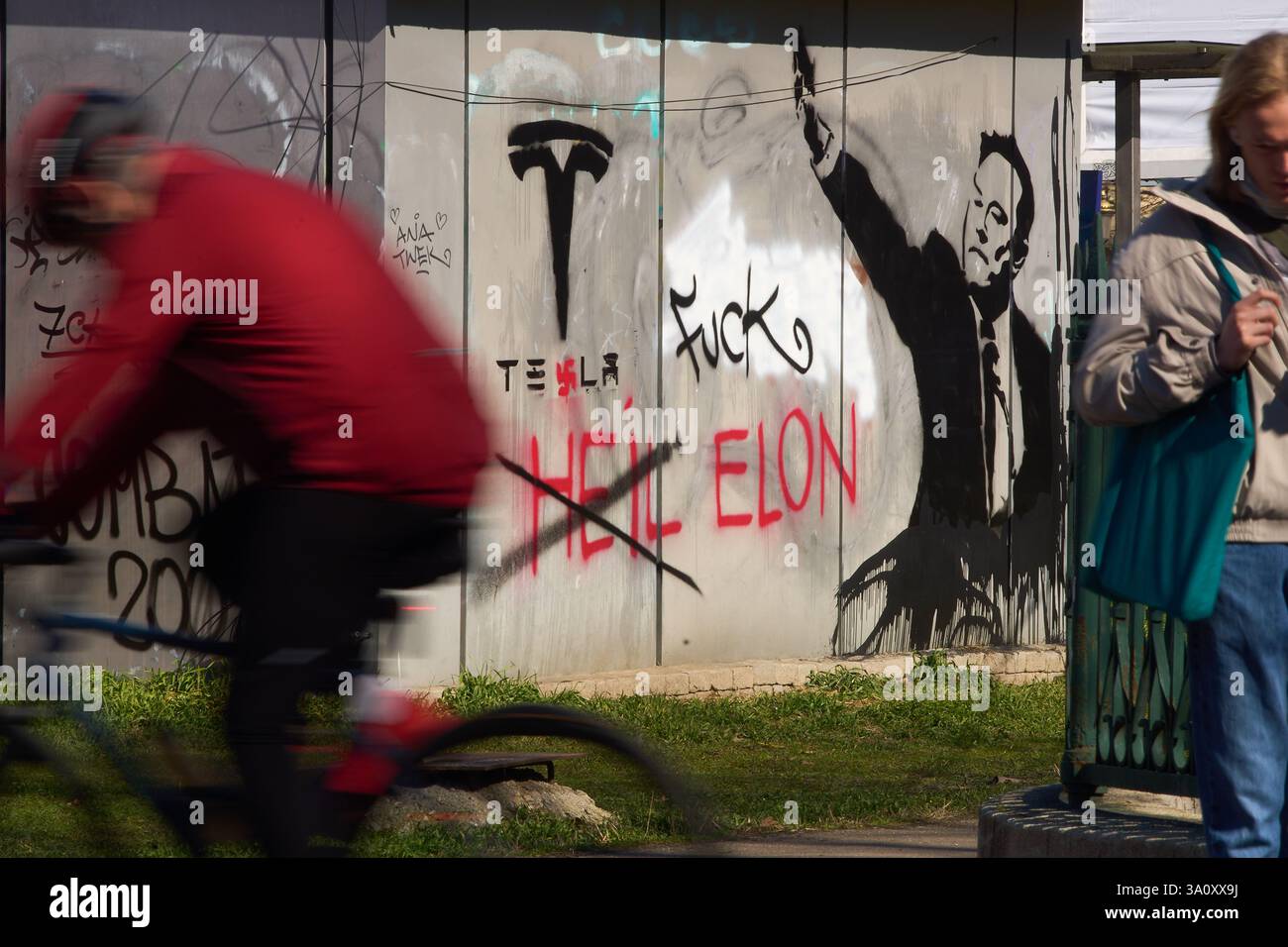 Bucharest, Romania. 5th Mar, 2025: People walk past a mural resembling ...