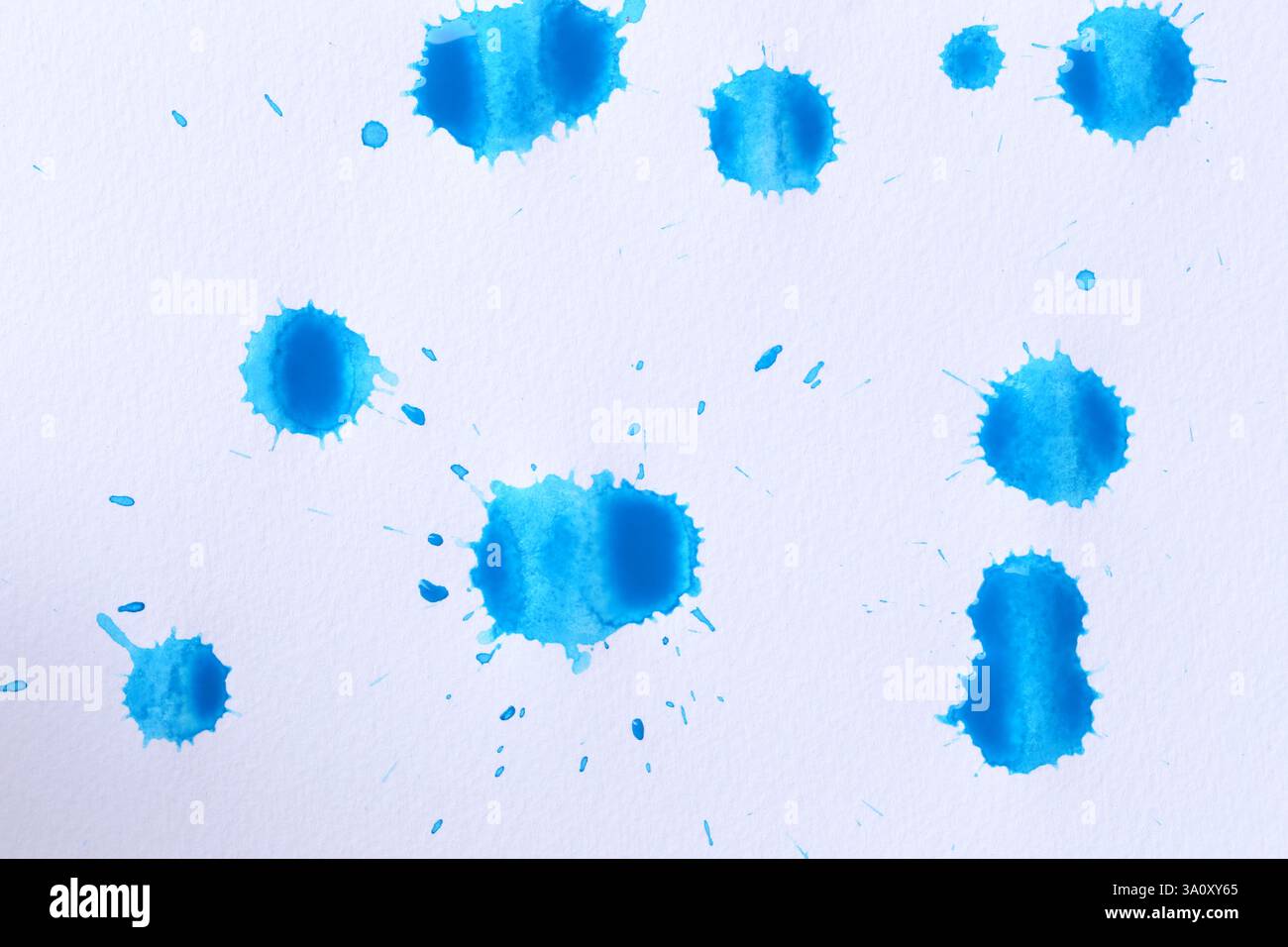 Blue color paint drops on paper, causing dispersion of color, use it ...