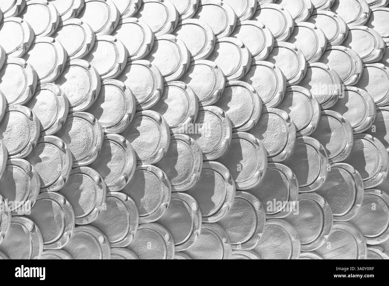 White patterns of stucco shaped like fish scales, Background of stacked ...