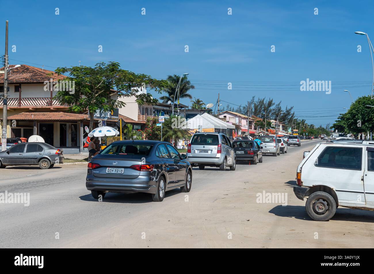 Cars passing along Estrada de Praia Seca road near Texas Street in ...
