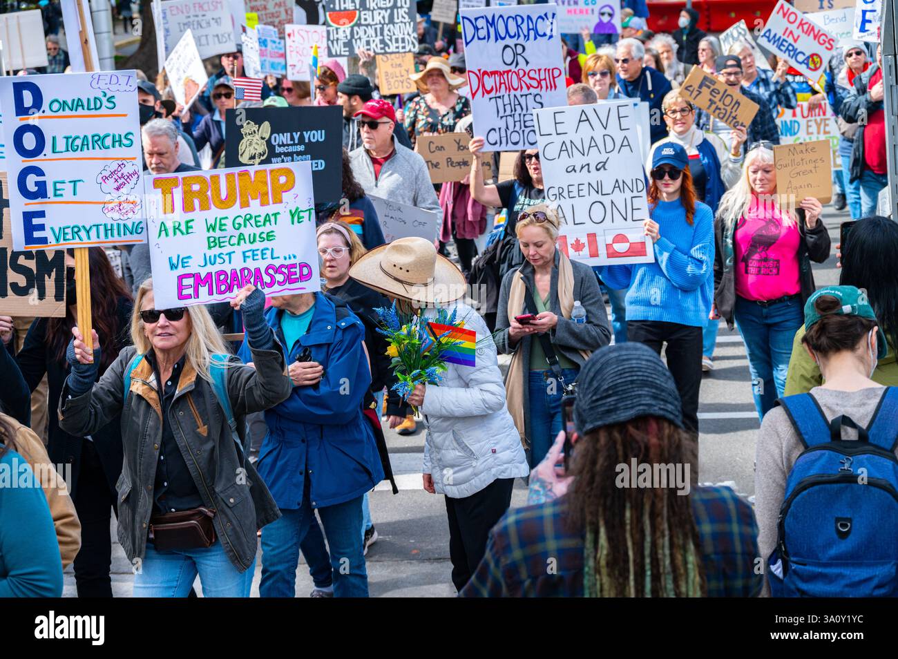 Sacramento, CA U.S.A. - Mar. 4, 2025: A sea of participants with signs ...