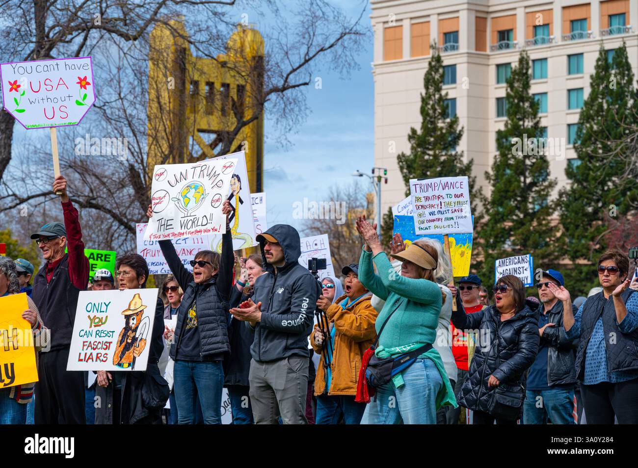 Sacramento, CA U.S.A. - Mar. 4, 2025: Part of the crowd holds signs ...