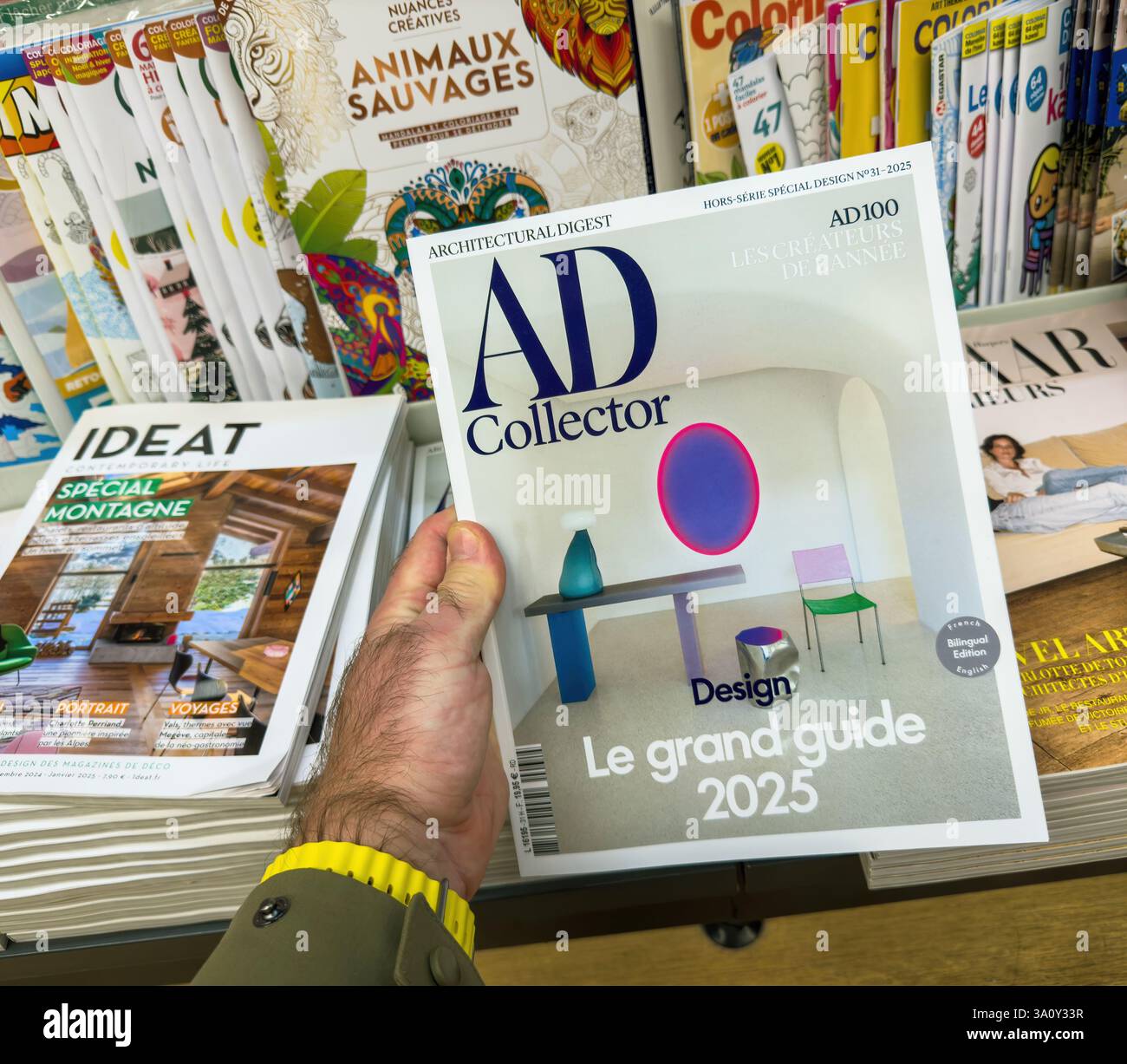 Person reading stack of magazines hi-res stock photography and images ...
