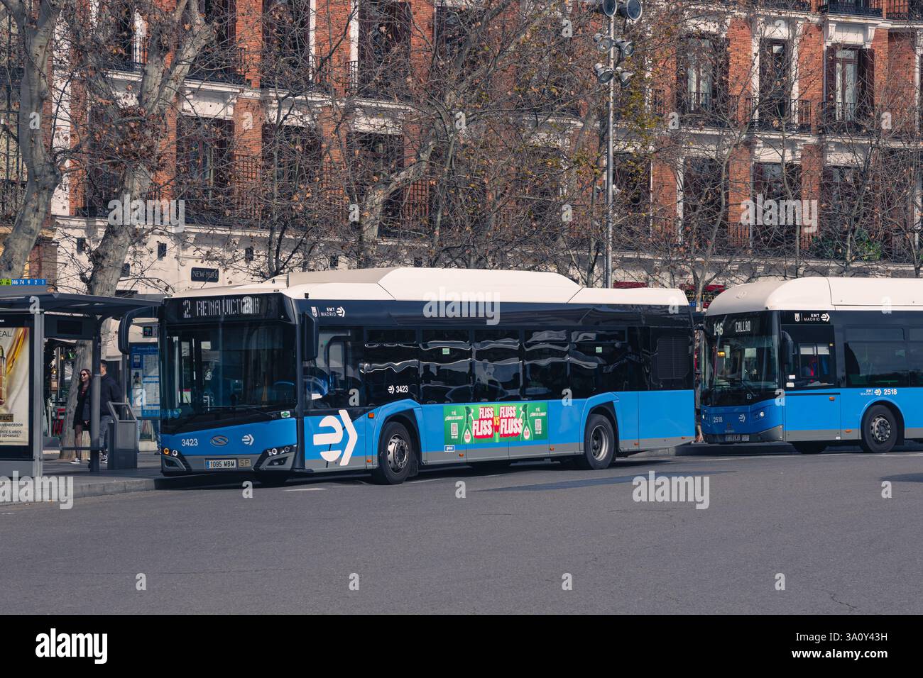 Madrid, Spain. February 15, 2025. A blue EMT Madrid bus at a city bus ...