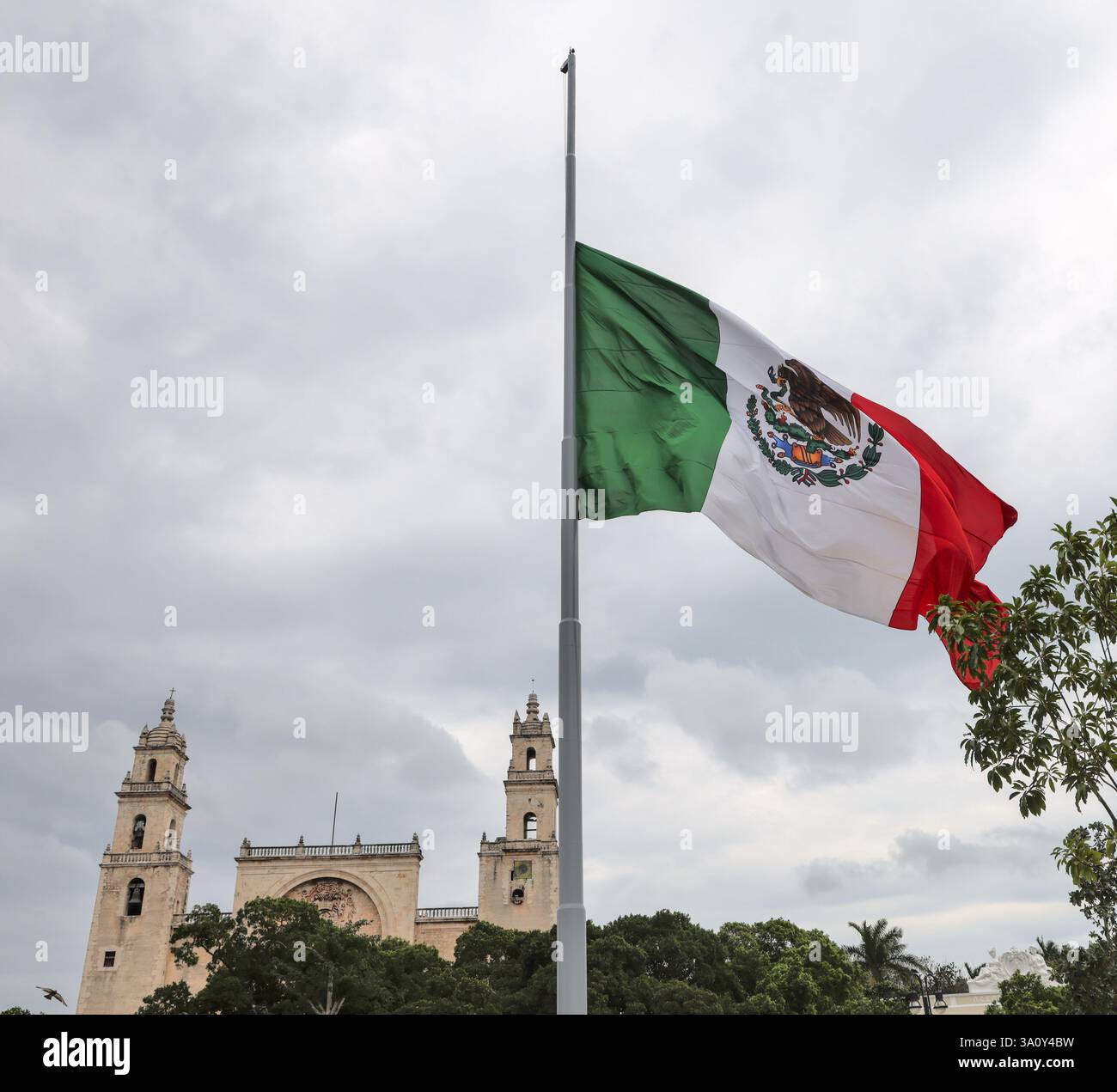 mexican flag in front of merida cathedral in capital of yucatan state ...