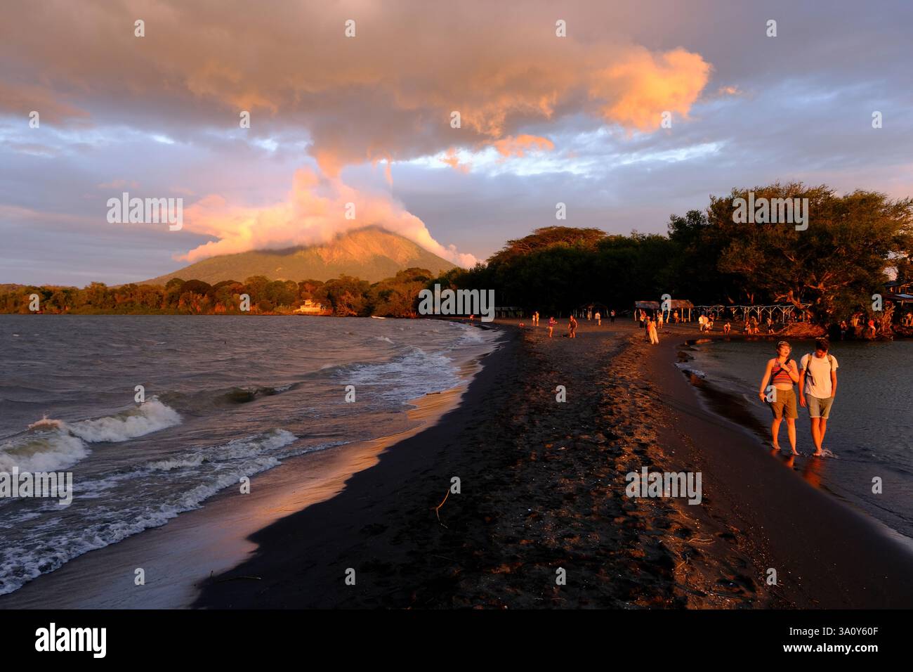 Visitors in Punta Jesus Maria before sunset on Lake Nicaragua with ...