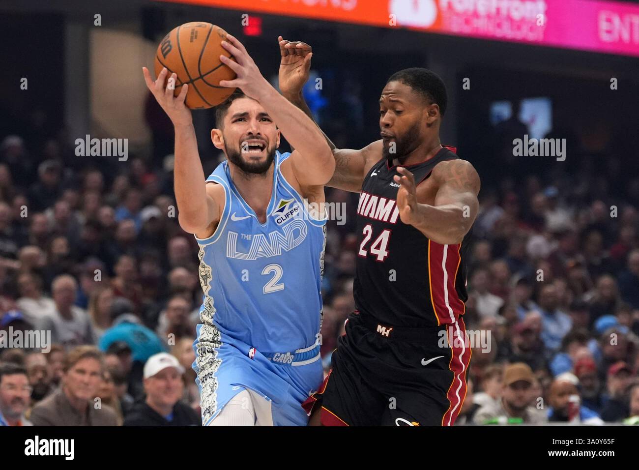 Cleveland Cavaliers guard Ty Jerome (2) drives past Miami Heat forward ...