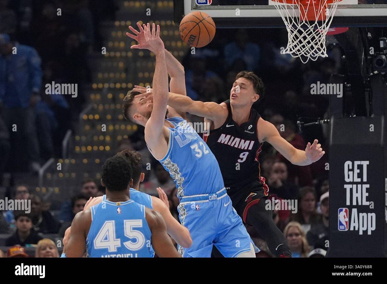 Miami Heat guard Pelle Larsson (9) fouls Cleveland Cavaliers forward ...