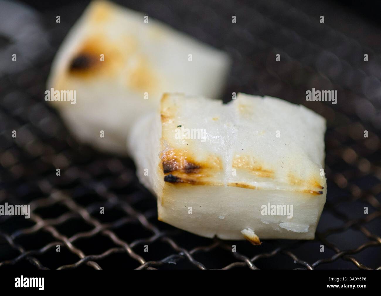 O-mochi rice cakes are grilled for o-zoni soup at Onigiri Cafe Risaku ...