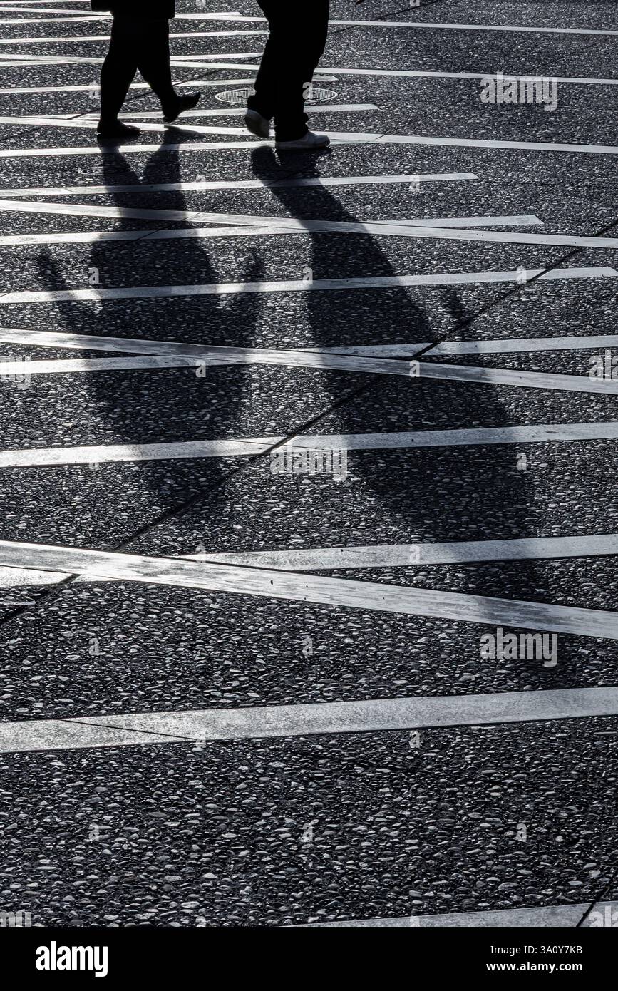 Shadows of people crossing Alaska Way in Seattle, Washington State, USA Stock Photo - Alamy