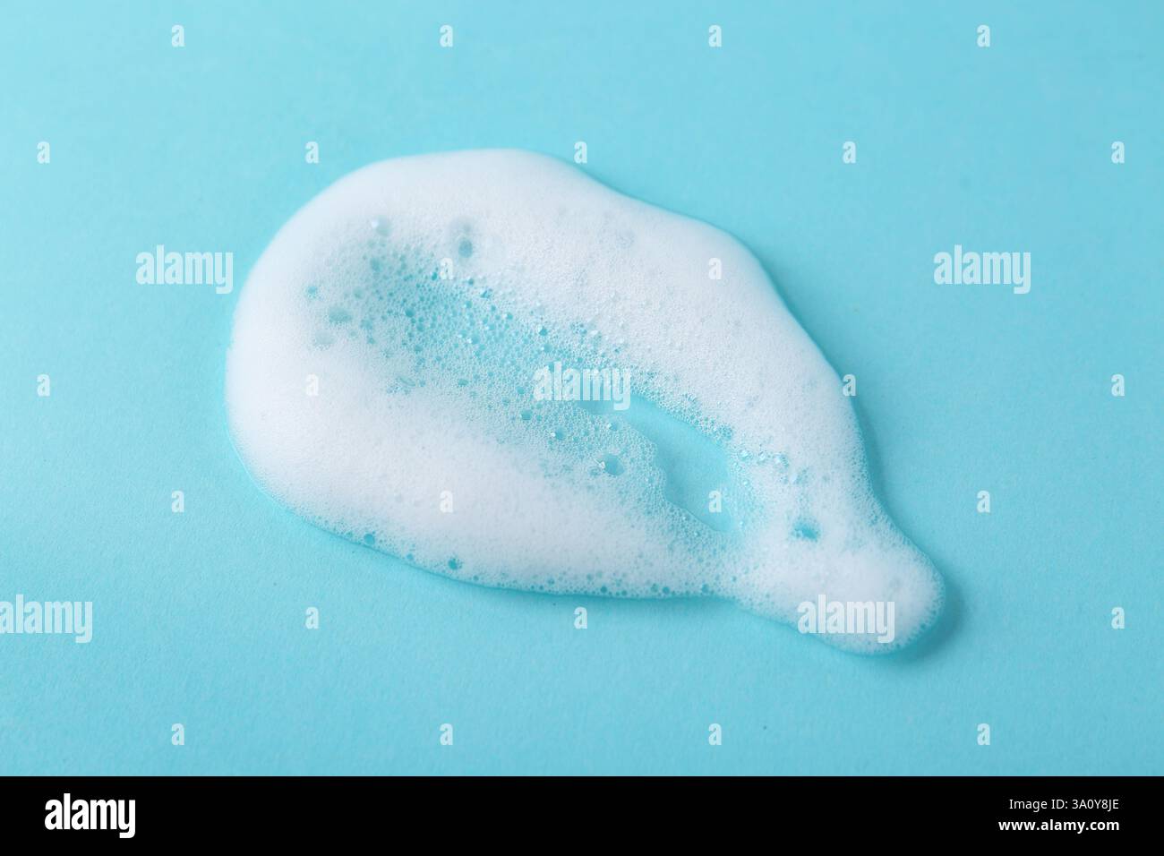 Sample of fluffy foam on light blue background, top view Stock Photo ...