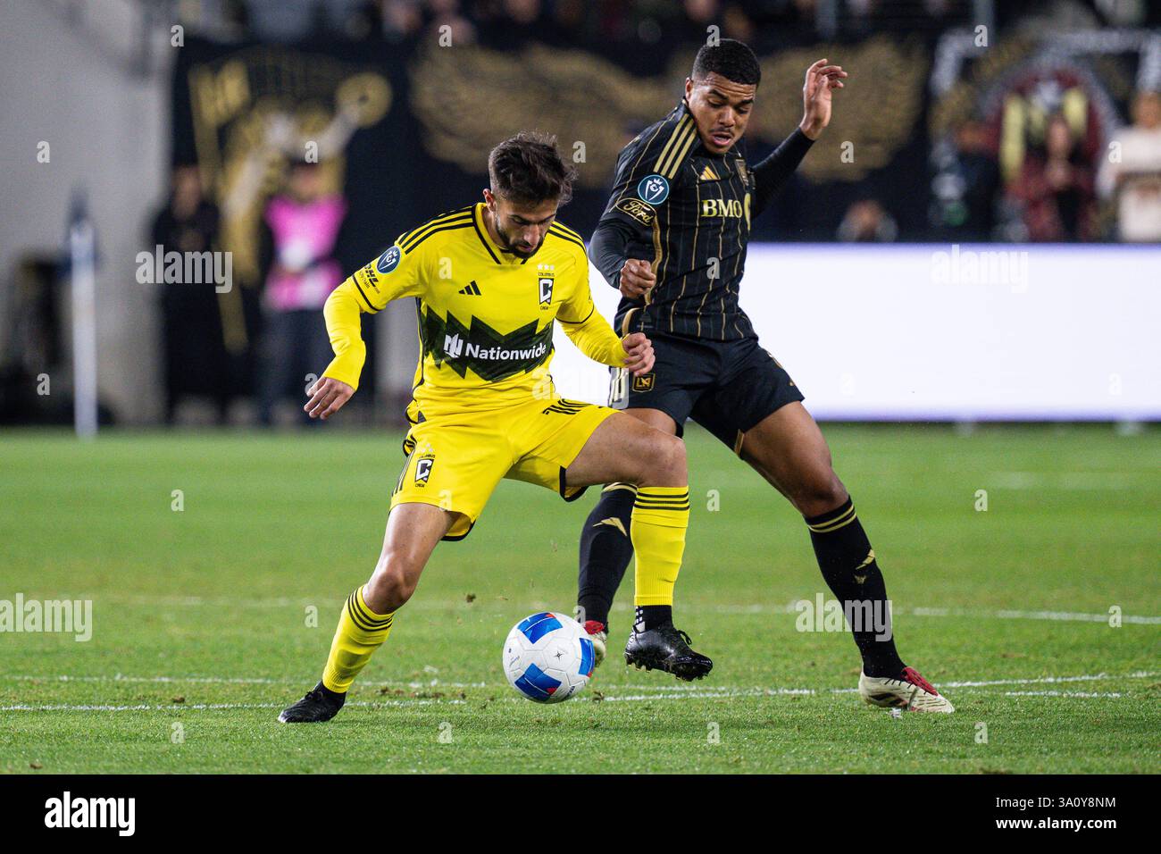 Columbus Crew forward Diego Rossi (10) is defended by LAFC midfielder ...