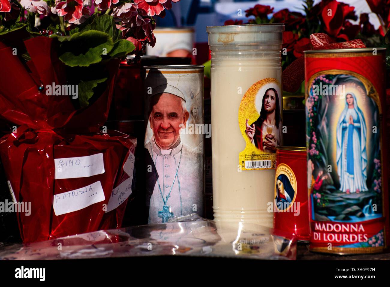Rome, Italy. 05th Mar, 2025. Tributes of flowers, images, candles and ...