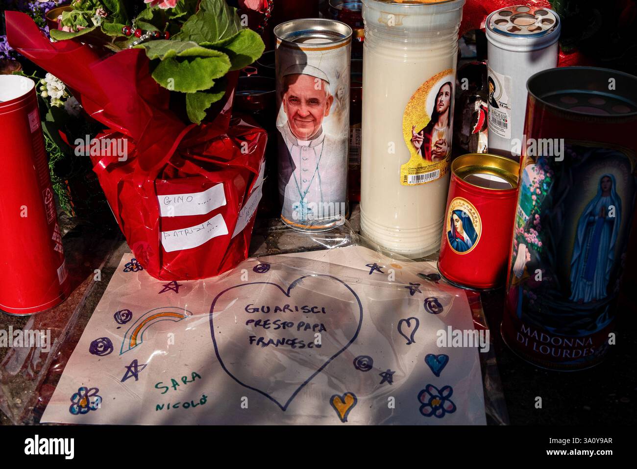 Rome, Italy. 05th Mar, 2025. Tributes of flowers, images, candles and ...