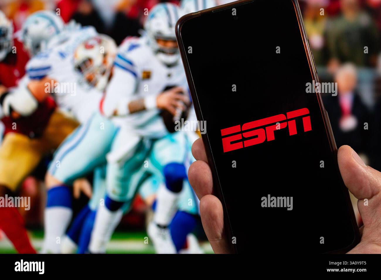 BOGOTA, COLOMBIA - MARCH 05 OF 2025 a male right hand with ESPN Sports ...