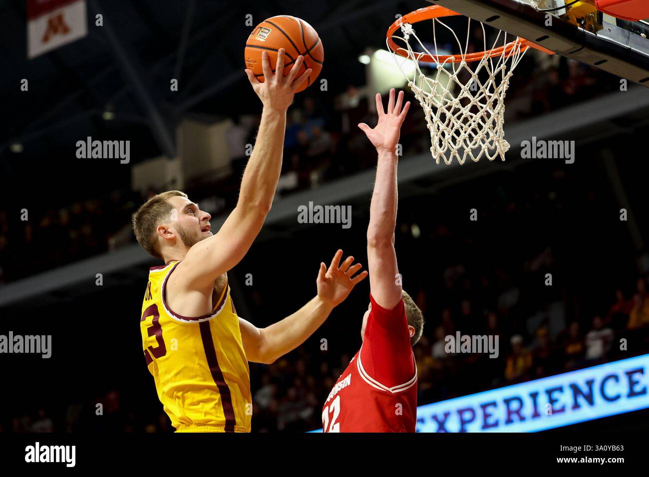 Minnesota forward Parker Fox (23) shoots against Wisconsin forward ...