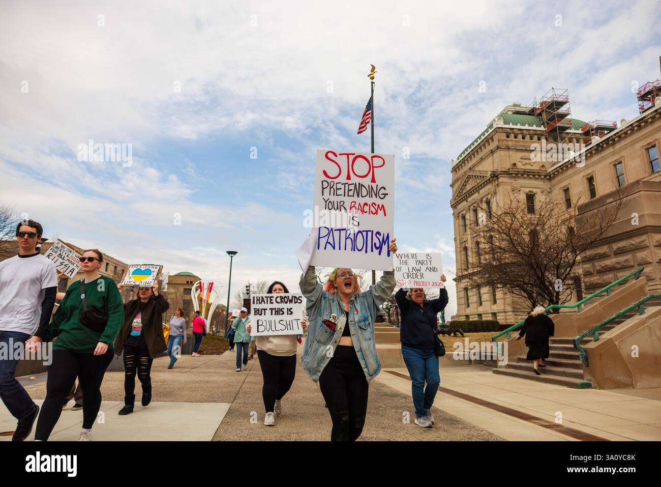 Indianapolis, United States. 04th Mar, 2025. A protester holds a sign ...