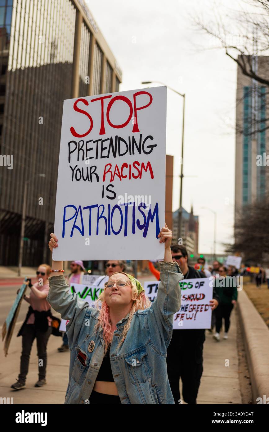Indianapolis, United States. 04th Mar, 2025. A protester holds a sign ...