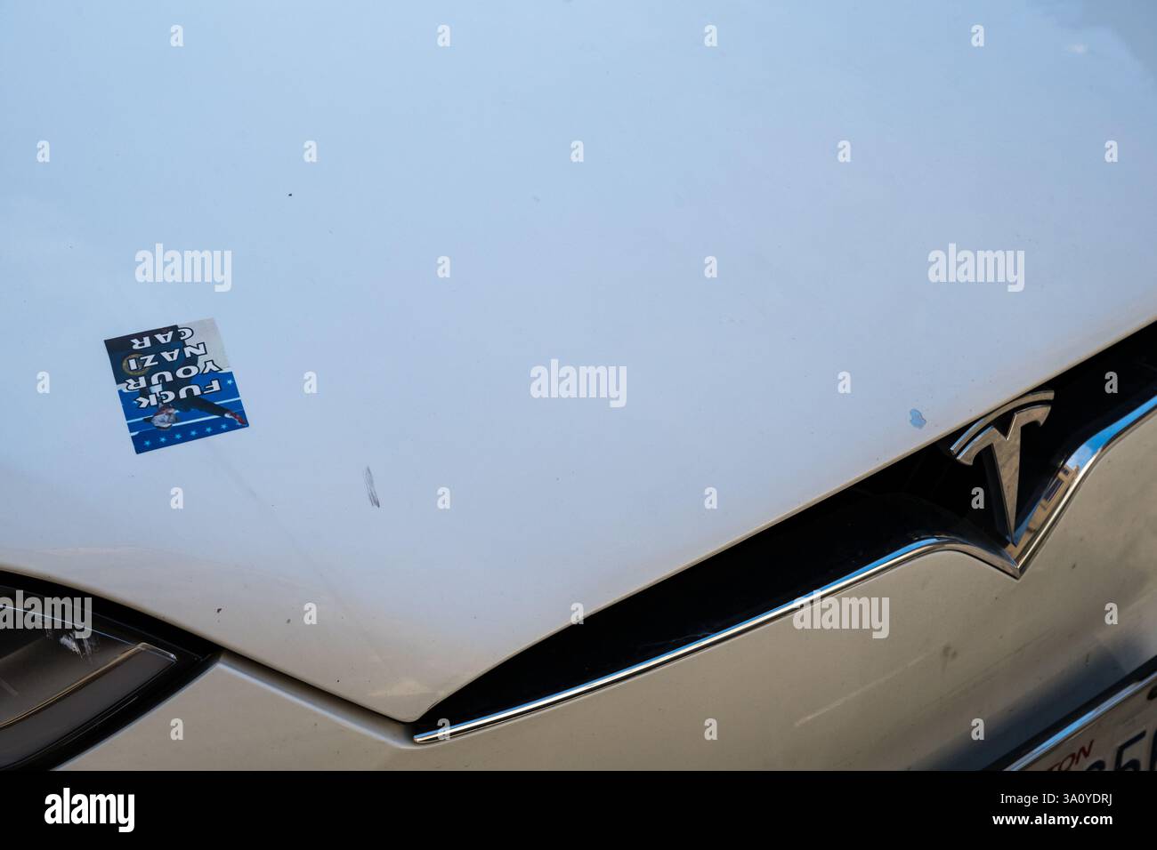Seattle, USA. 5th Mar 2025. Anti - Elon Musk stickers seen on a Tesla ...